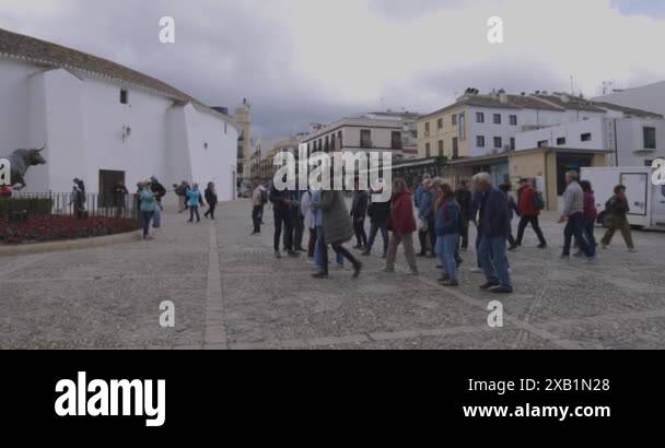 Ronda, Spain, May 19, 2024: Plaza de Toros square with people walking ...