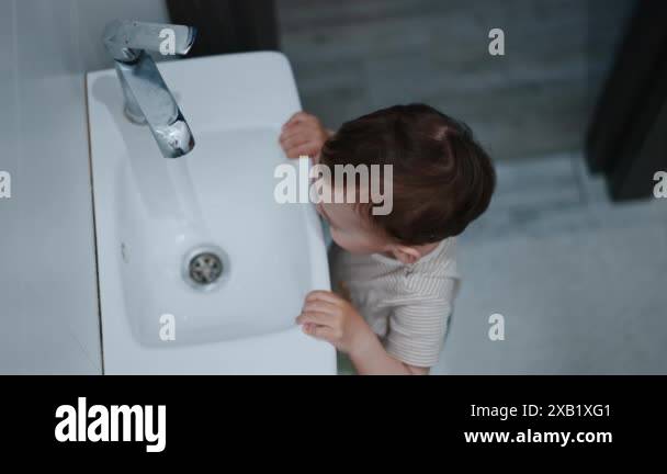 Kid playing with water at sink Stock Videos & Footage - HD and 4K Video ...