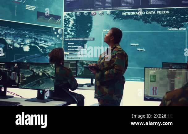 Woman high tech specialist studying satellite CCTV visualization on a ...