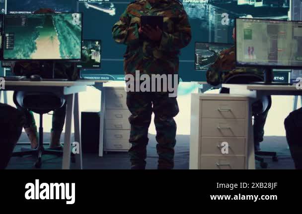 Woman sergeant major working on deployment of electronic warfare tools to disrupt enemy ...