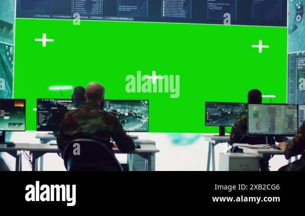 Diverse group of privates operating on a big screen isolated display ...