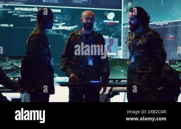 Navy operation specialists monitoring surveillance radar through a hologram, working with 3d ...