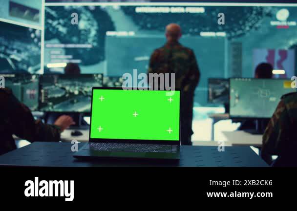 Greenscreen running on a laptop in military base command center, team ...