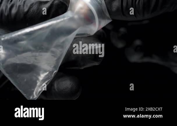 Hands in Black Gloves Place the Pulled-out Human Tooth in Blood into a ...