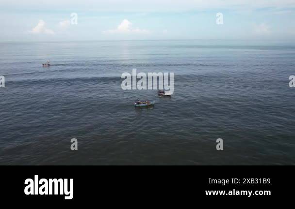Fishing boats anchored off Ladghar beach at Dapoli, located 200 kms ...