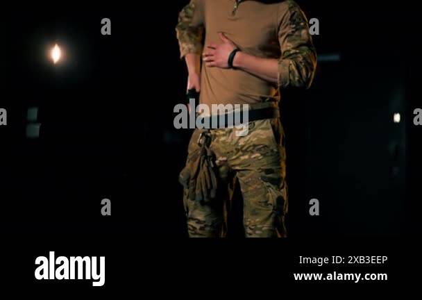 at a professional shooting range military trainer reloading a pistol ...