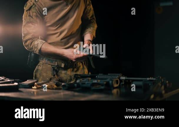 in a professional shooting range a professional fighter assembles a ...