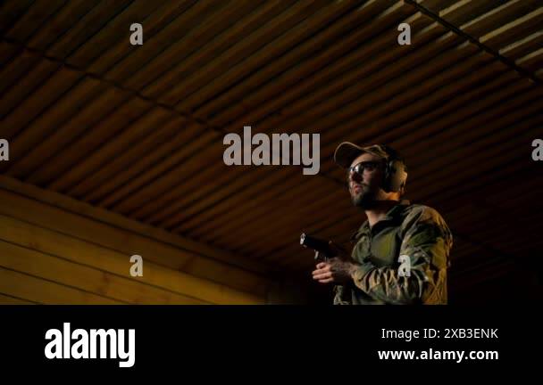 close up at a professional shooting range military trainer reloading a ...