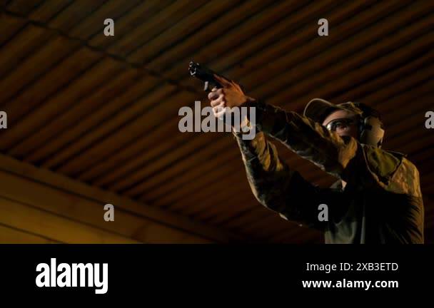 close up at a professional shooting range military trainer reloading a ...