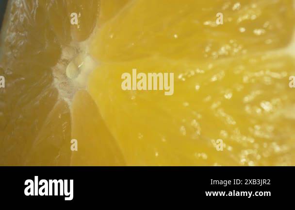 The macro photography of a sliced orange with vibrant orange color and ...