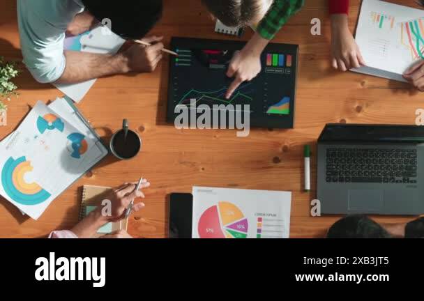 Top down view of business woman explain and present financial chart ...