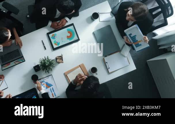 Top view of executive manager present increasing graph while team clap ...