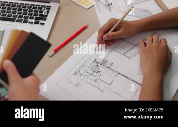 Slow motion interior designer using architectural equipment draw a ...