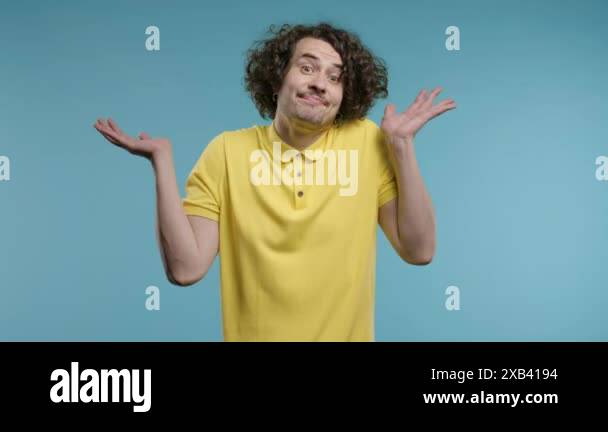 Confused man, shoulders up - cant help, makes gesture of I dont know ...