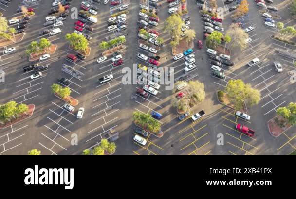 Large parking lot with many parked cars. Big carpark at supercenter ...