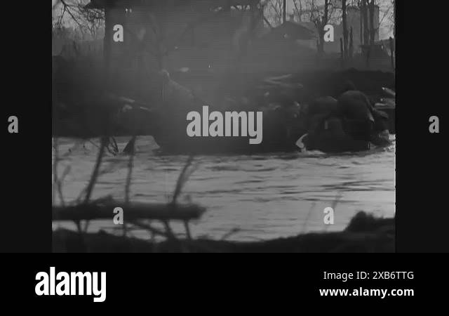 1945 - Assault boats loaded with American troops move down the Roer ...