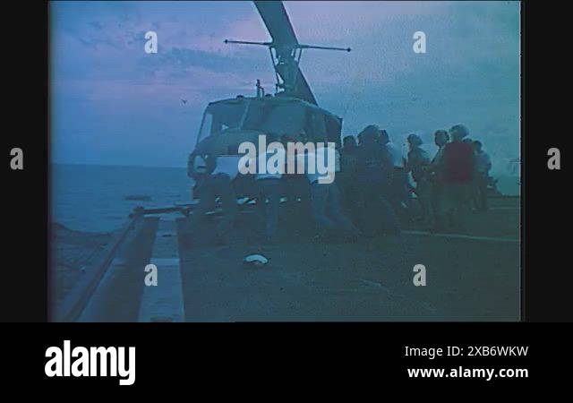 VIETNAM - 1975 - US Navy helicopters are pushed overboard of the USS ...
