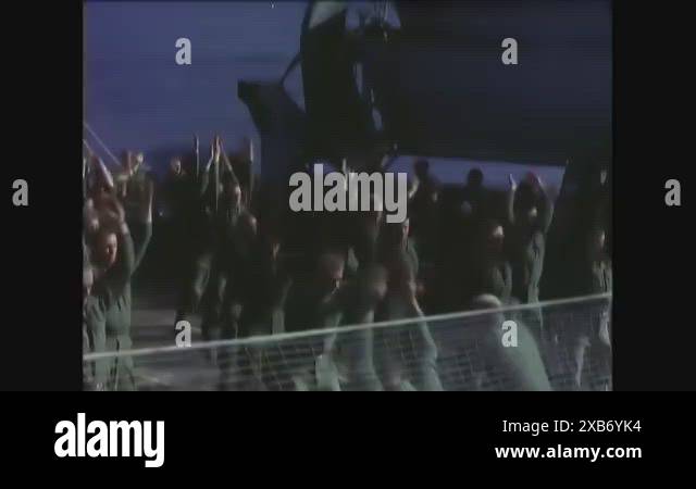 1966 - The 9th Infantry Division does calisthenics on the deck of the ...