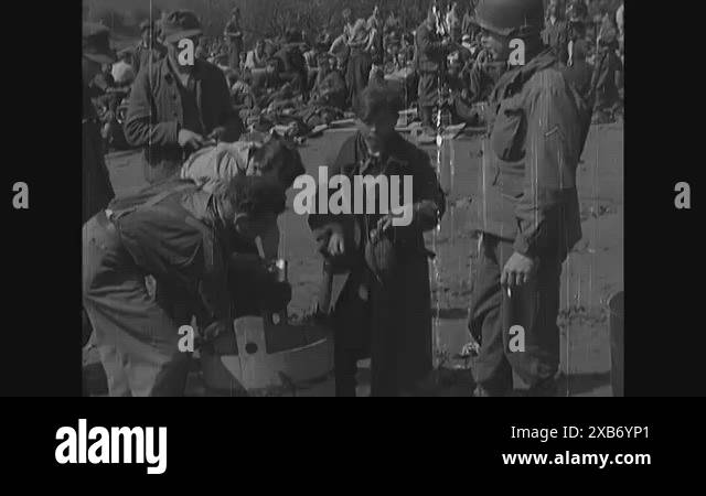 1945 - Young German soldiers drink from their canteens, undergo ...