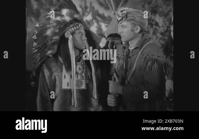 US - 1957 - in this western, a Native American throws his tomahawk into ...