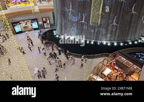 Dubai, UAE 01.06.2024 Shoppers Admiring the Dubai Mall Waterfall ...