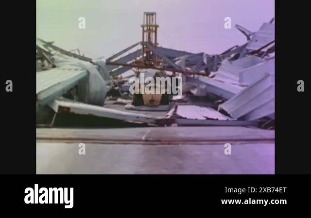 1979 - Emergency vehicles drive through the wreckage of Mobile, Alabama ...