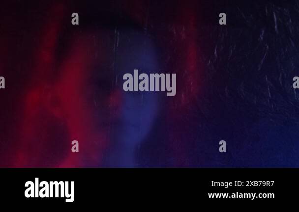 Sad girl. Blur silhouette. Neon portrait in dark red color desperate ...