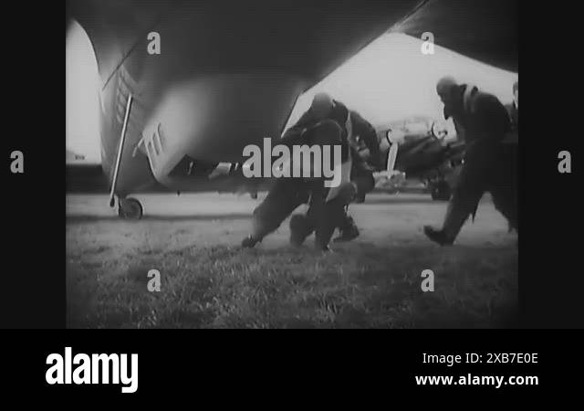 1940 - Luftwaffe pilots get into their planes and take off from an ...