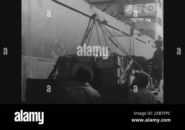 1950 - In Hungnam Harbor, North Korea, freight and an army jeep are ...