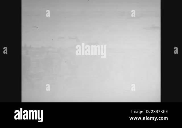 1945 - US marines carry communication wires and weapons while General ...