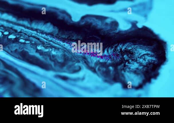 Ink spill. Acrylic paint flow. Defocused blue black color water ...