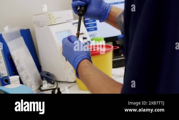 Crop doctor mixing blood with chemicals. From above closeup handheld ...