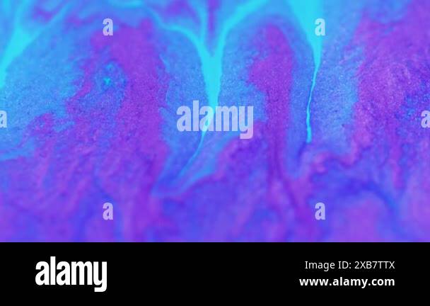 Ink spill. Liquid glitter texture. Defocused neon blue purple color ...