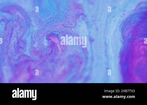 Shiny ink spill. Acrylic liquid flow. Defocused purple pink blue color ...