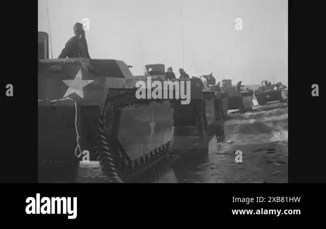 1950 - US troops line up and load into amphibious vehicles for the ...