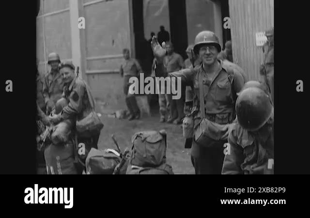 1945 - Soldiers play music and socialize before boarding onto transport ...