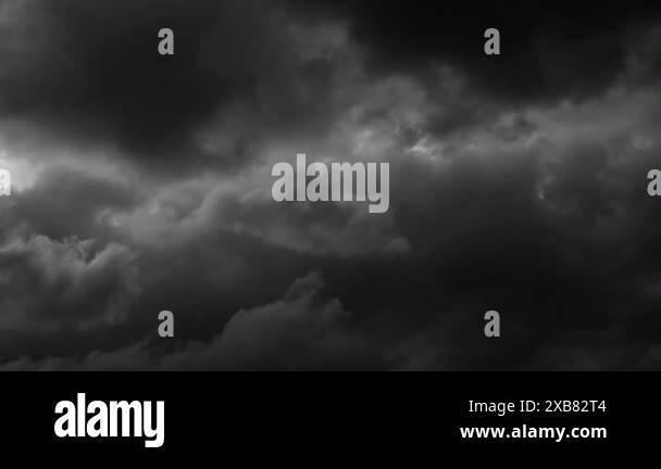 time-lapse of separate white clouds on a black background have real ...