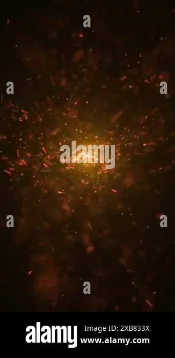Vertical video - glowing red hot sparks emitting and exploding from a pyrotechnic sparkler. Full ...