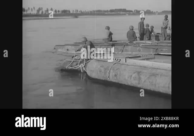 1945 - US Army engineers begin constructing treadways for a pontoon ...