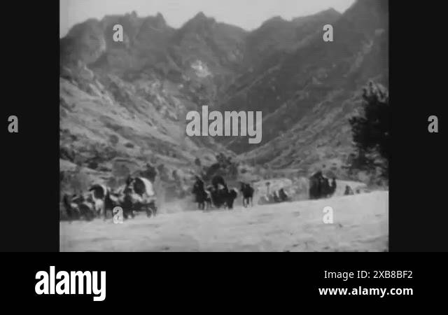 1952 - In this western film, a posse on horseback shoots at a wagon ...