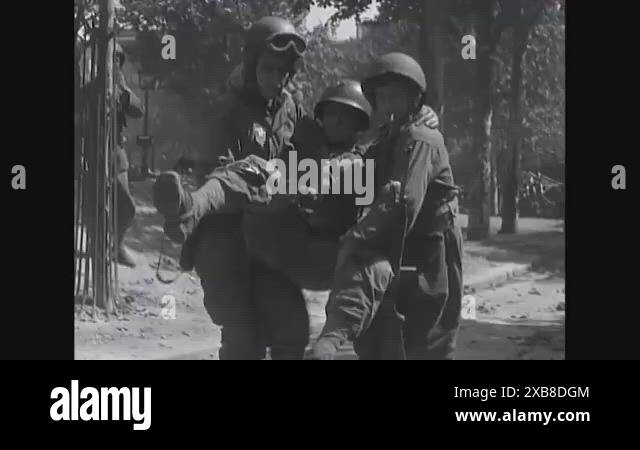 1944 - During the liberation of Paris a wounded French soldier is given ...