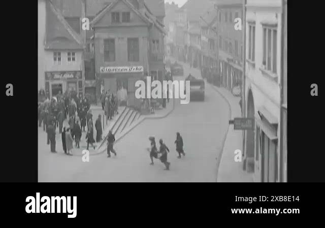 1945 - Wounded Nazi POWs sit outside a Red Cross building in ...