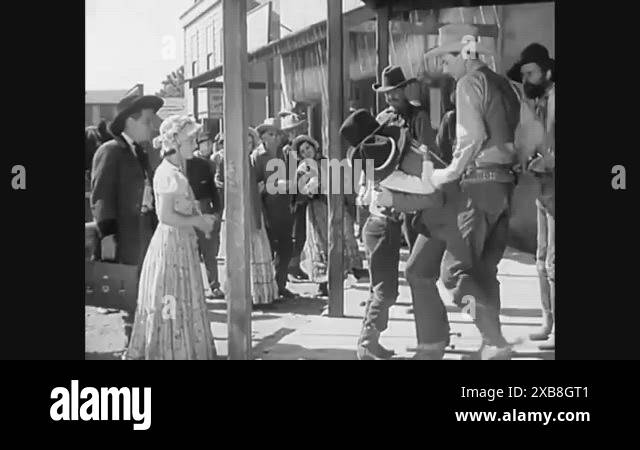 1932 - In this western, a man with his hands tied by a rope grabs a gun ...