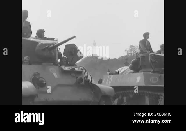 1944 - During the celebration of the liberation of Paris, men of the ...