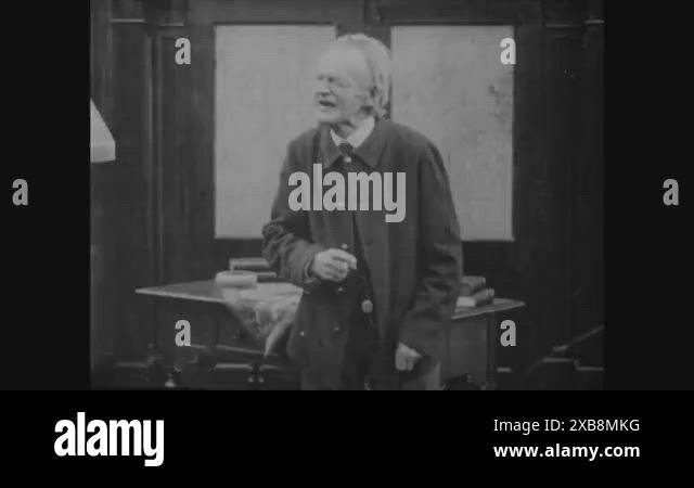 1916 - In this silent film, a young woman shows an old man a photo of a ...