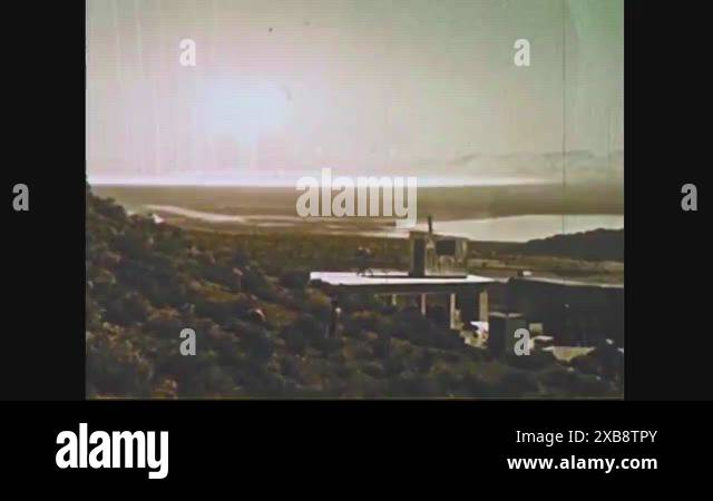 At atomic mushroom cloud is contrasted with scientists carefully using ...