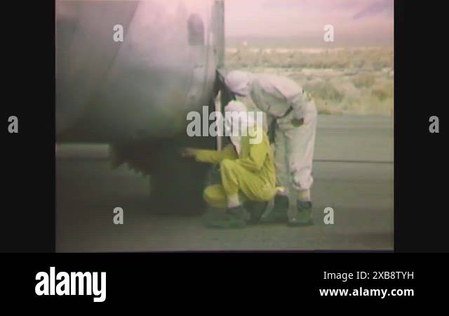 1967 - Men on a USAF radiological monitoring team use a Geiger counter ...