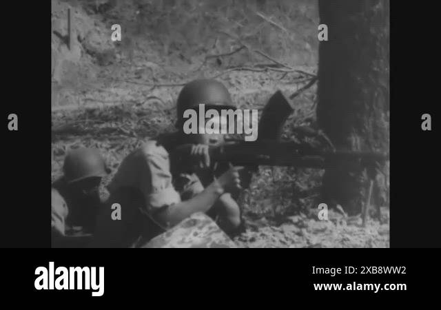 1940s - Chinese troops are firing machine guns, running through a ...