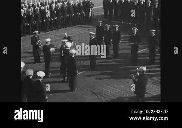 1943 - Aboard the USS Card Royal E. Ingersoll pins medals on crew ...
