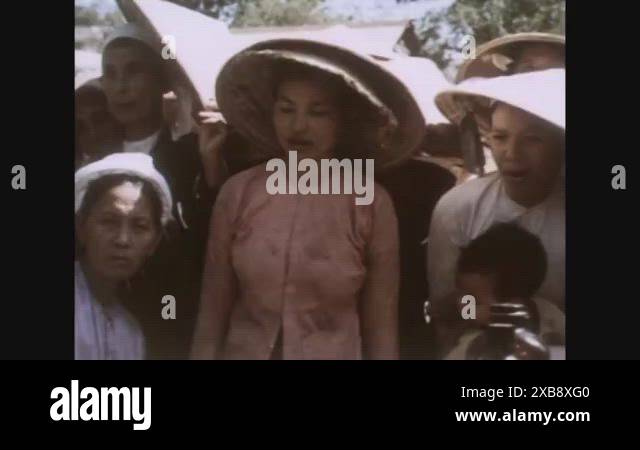 1960s - American soldiers provide medical care to residents of a remote village in Vietnam, and ...
